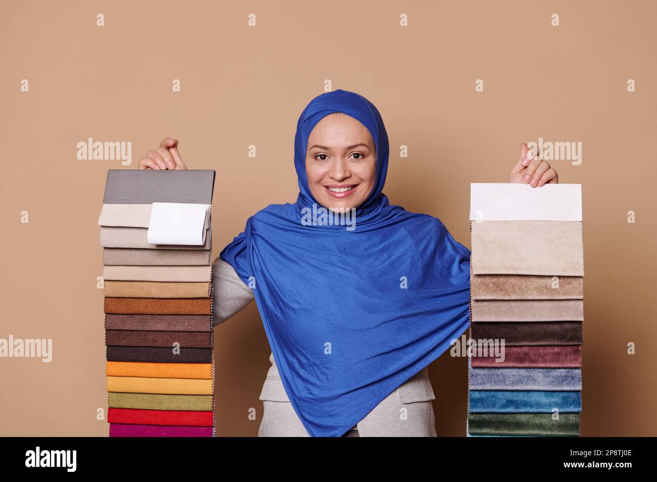 Arabic business woman in blue jacket hi-res stock photography and ...