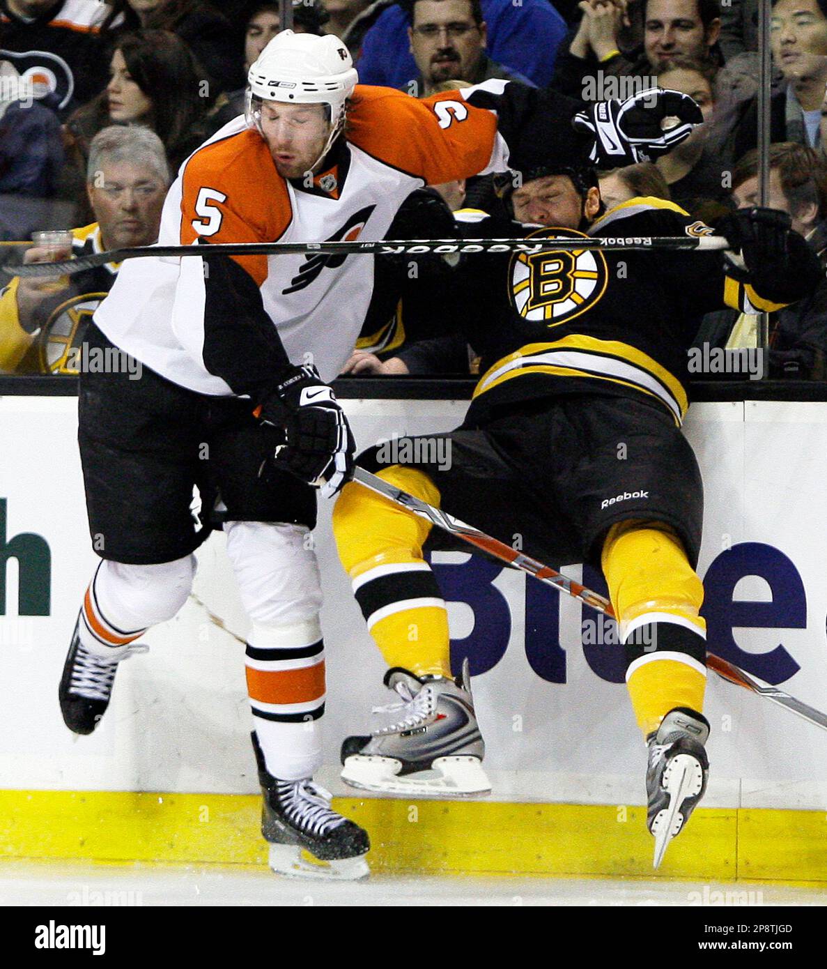Philadelphia Flyers defenseman Braydon Coburn (5) checks Boston Bruins ...