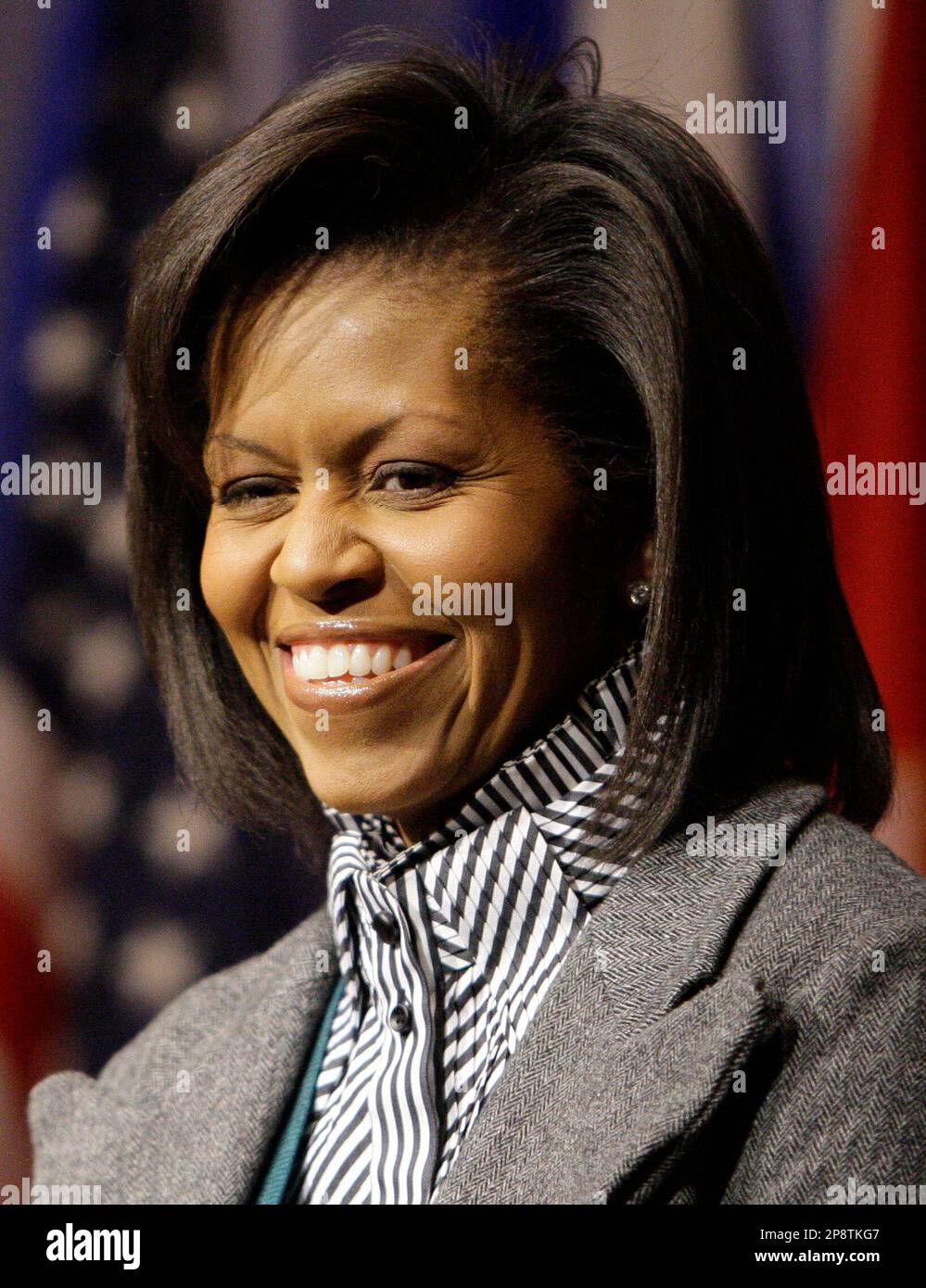 First lady Michelle Obama reacts as Retired Gen. Wilma L. Vaught, not ...