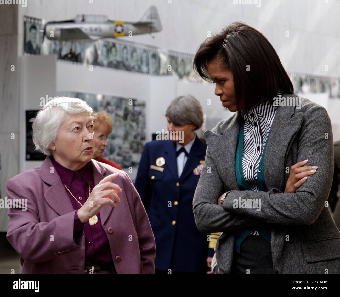 First Lady Michelle Obama, right, listens to Retired Brig. Gen. Wilma L ...