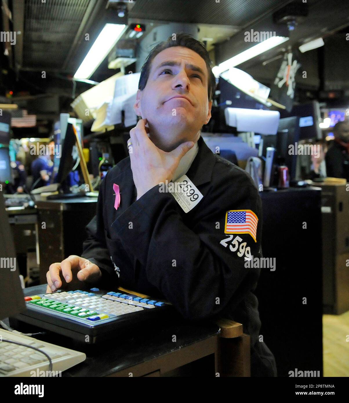 Specialist Charles Solomon works on the floor of the New York Stock ...