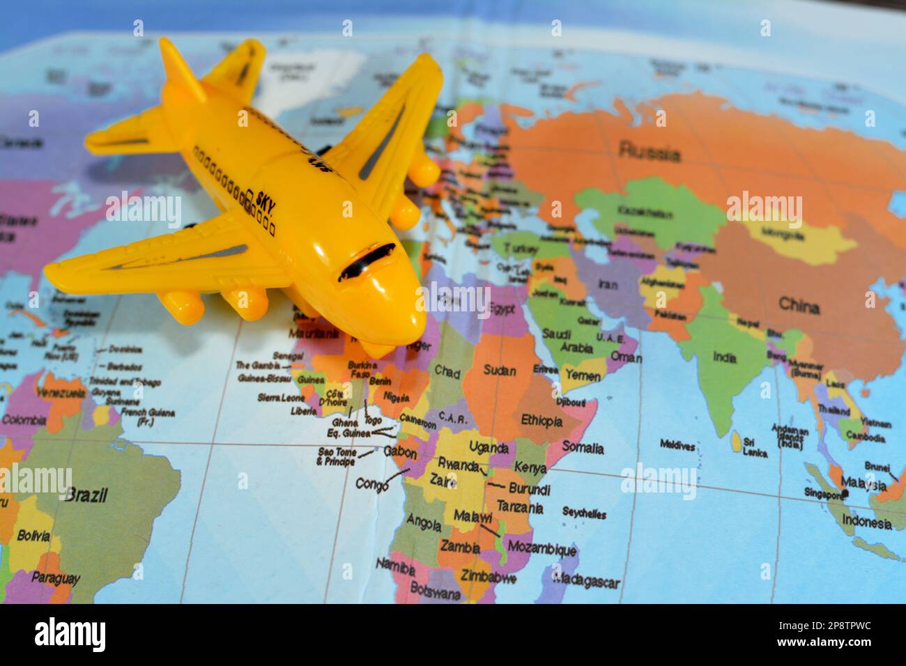 Colorful world map with airplane on it with the continents Africa ...