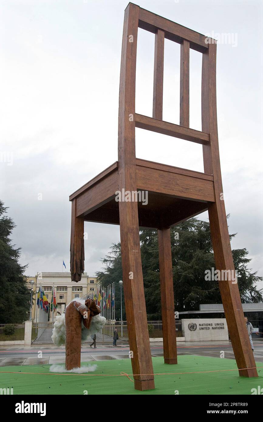 A leg of the 'Broken Chair' sculpture seems to explode during a ...