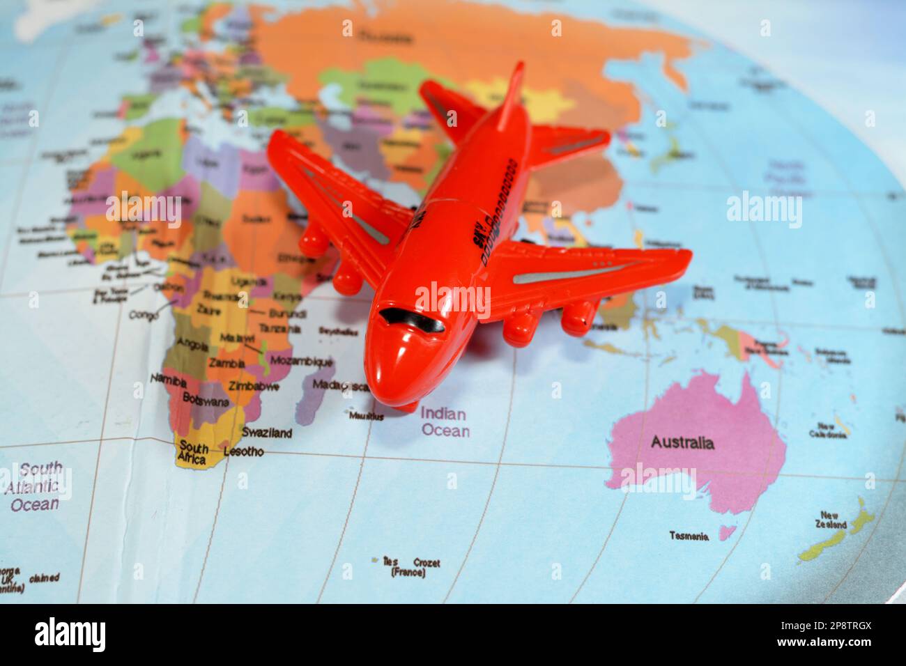 Colorful world map with airplane on it with the continents Africa ...