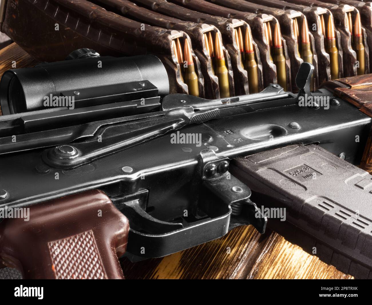 Close-up photo of Kalashnikov assault rifle and an ammo. Preparation ...