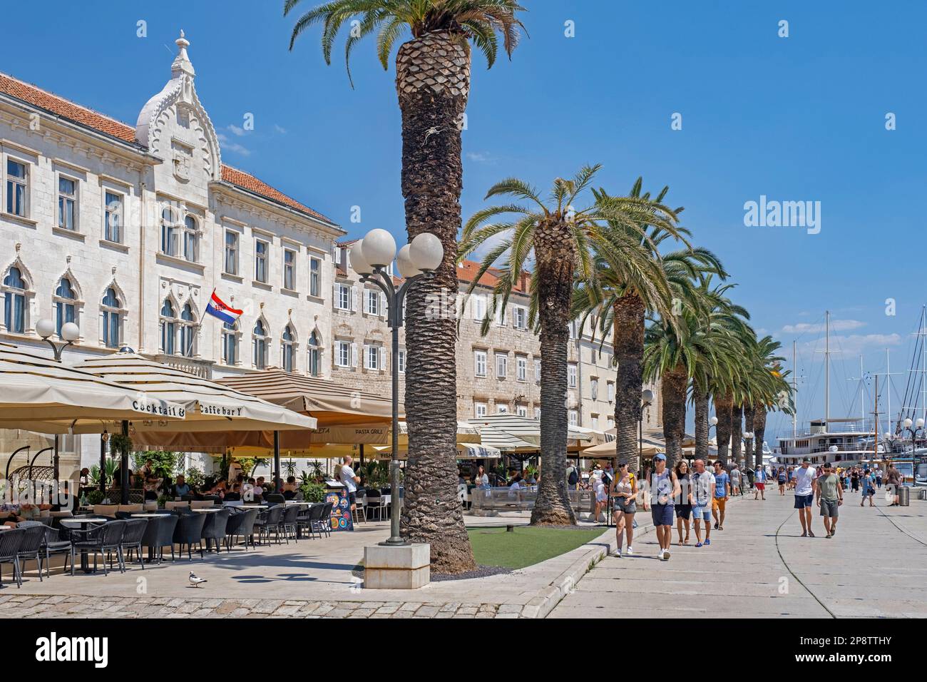Restaurants and cafes along promenade at harbour of the historic Old Town of Trogir along the ...