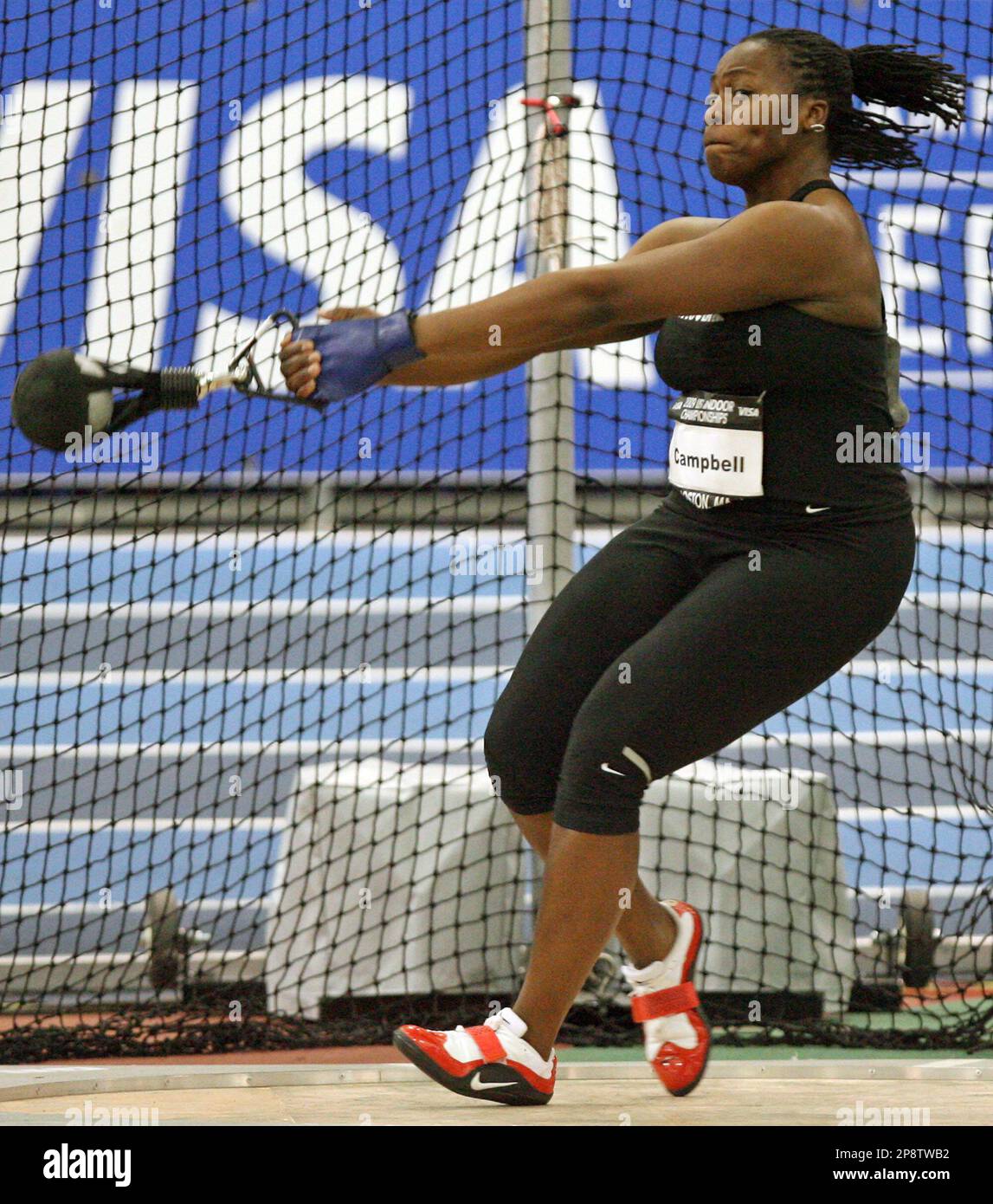 Amber Campbell competes in the weight throw during the US Indoor Track ...