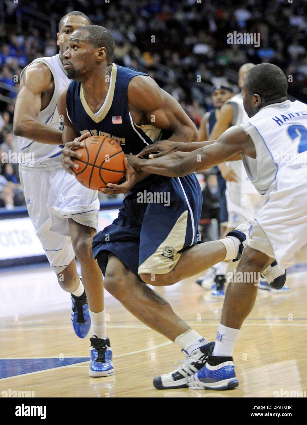 Pittsburgh's Sam Young drives to the basket as he cuts between Seton ...