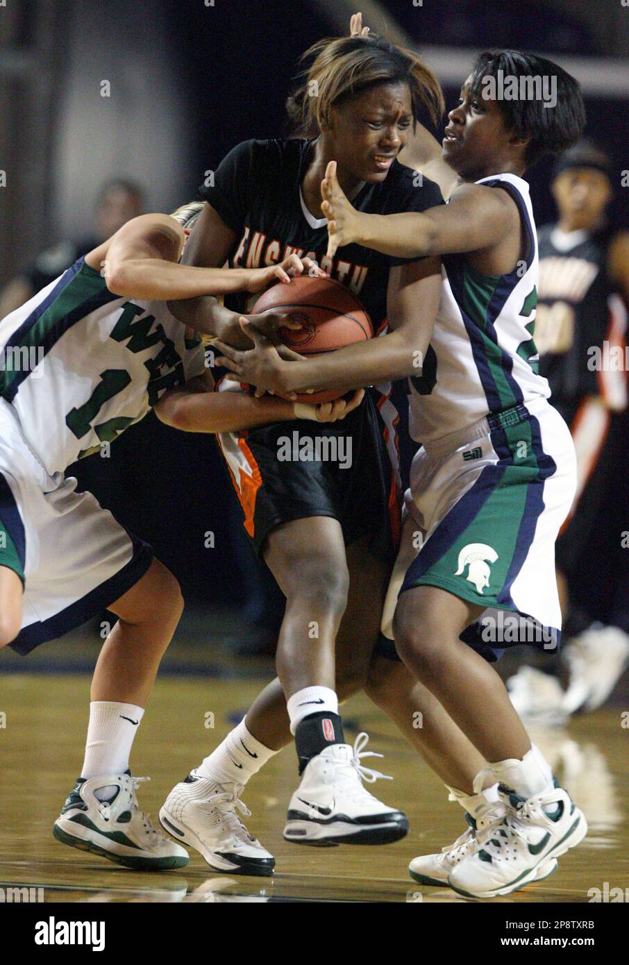 Jessica Goswitz (14) and Lynae Berry (20) of Knoxville Webb pressure of ...