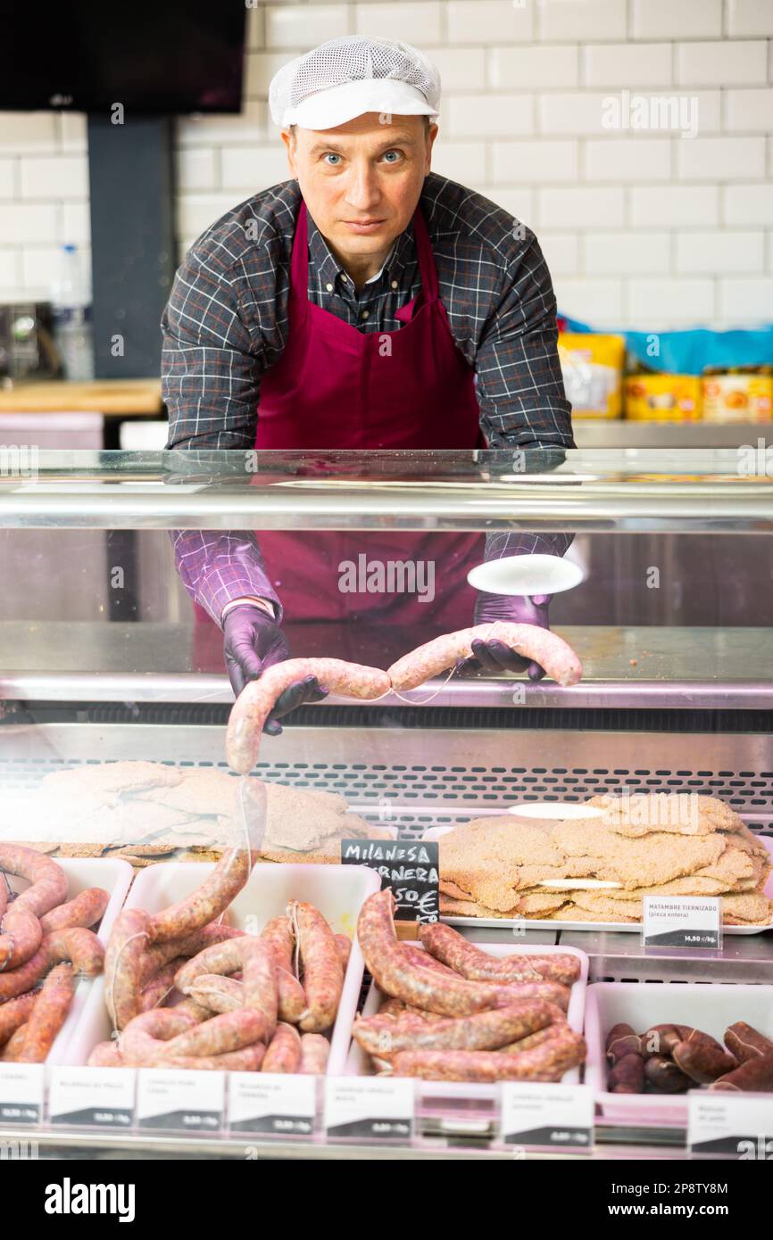 Adult man puts meat hi-res stock photography and images - Alamy