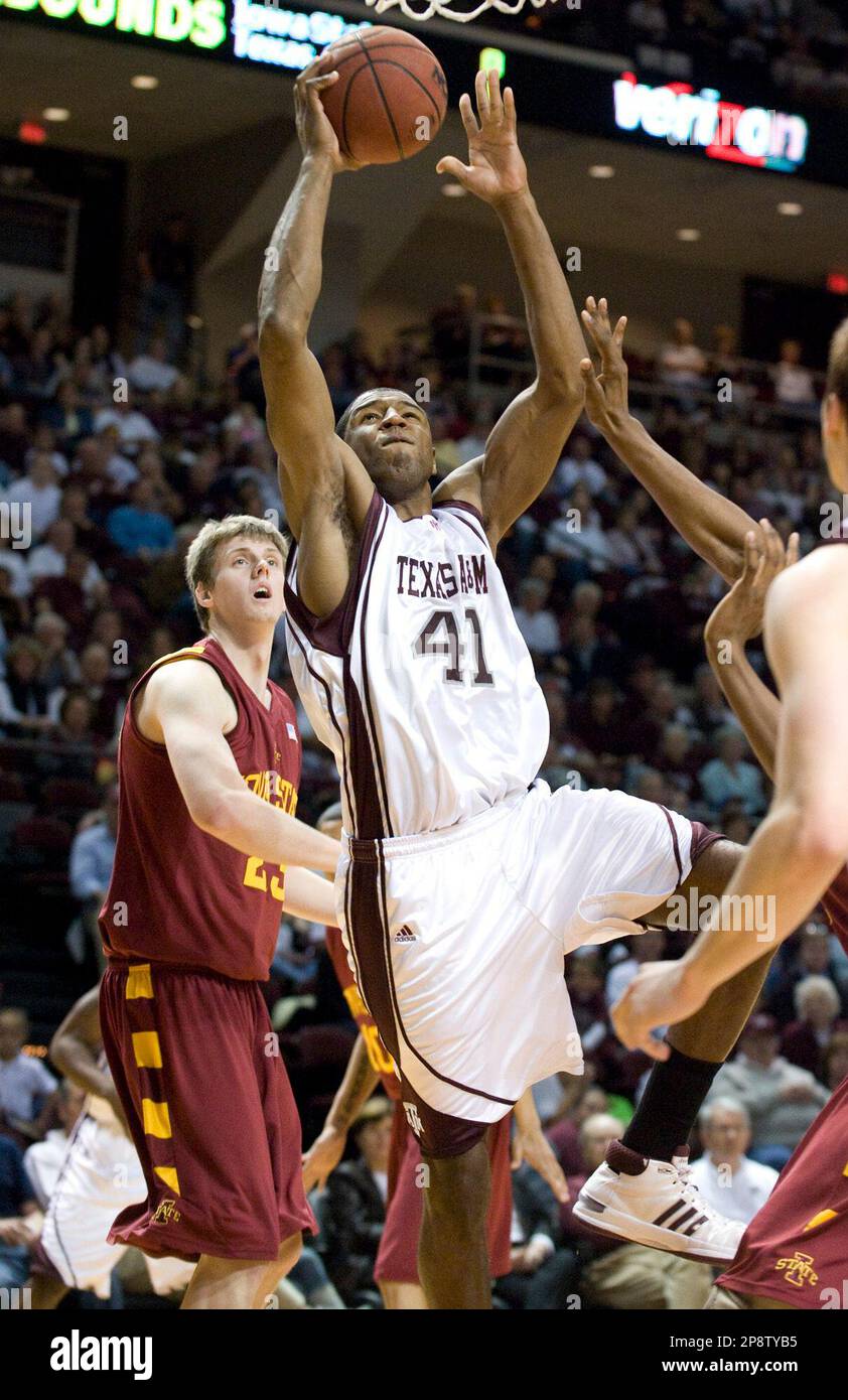 Texas A&M's Chinemelu Elonu, right, drives to the hoop past Iowa State ...