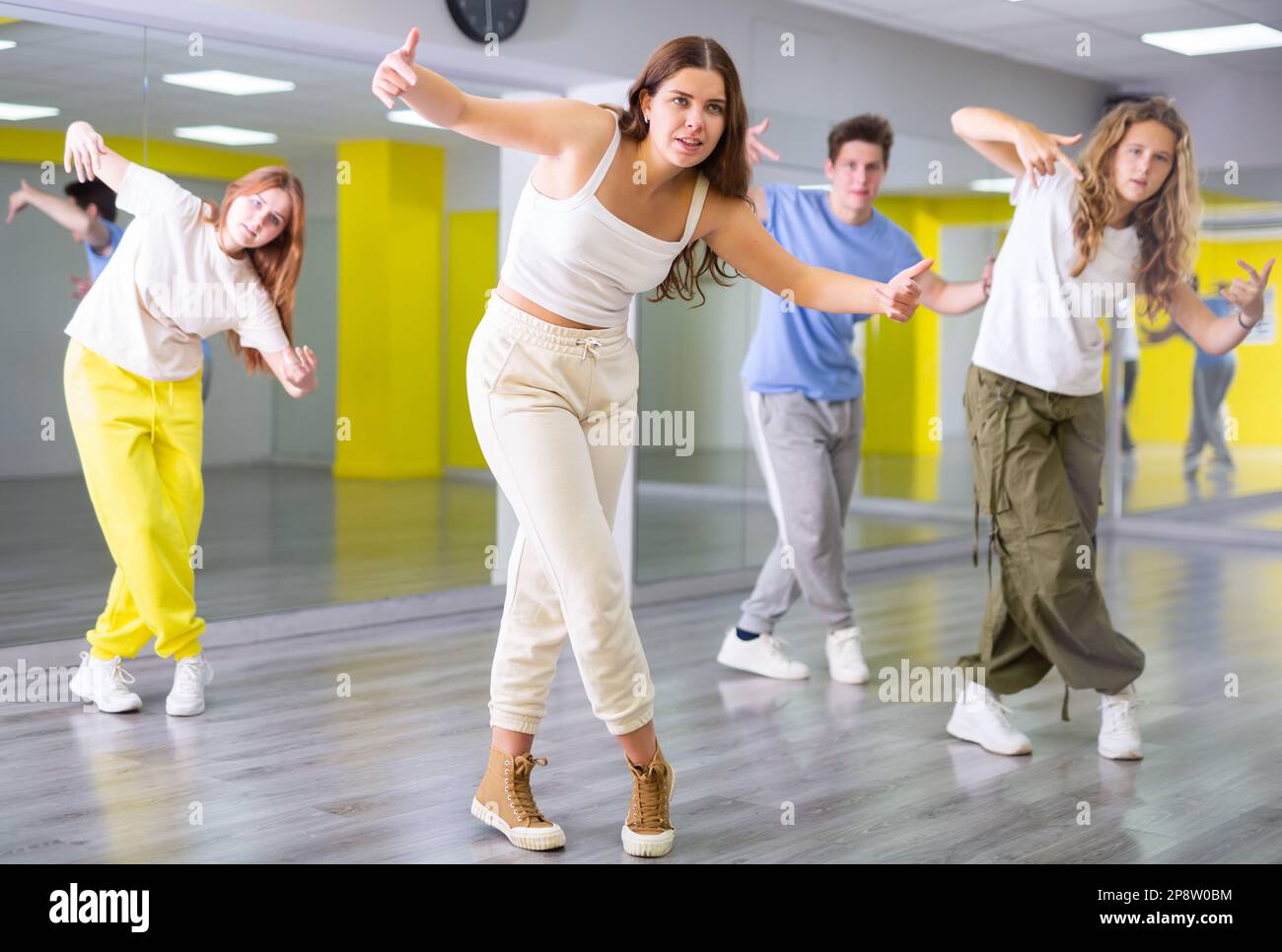 Young girl training breakdance Toprock moves in dance hall Stock Photo ...