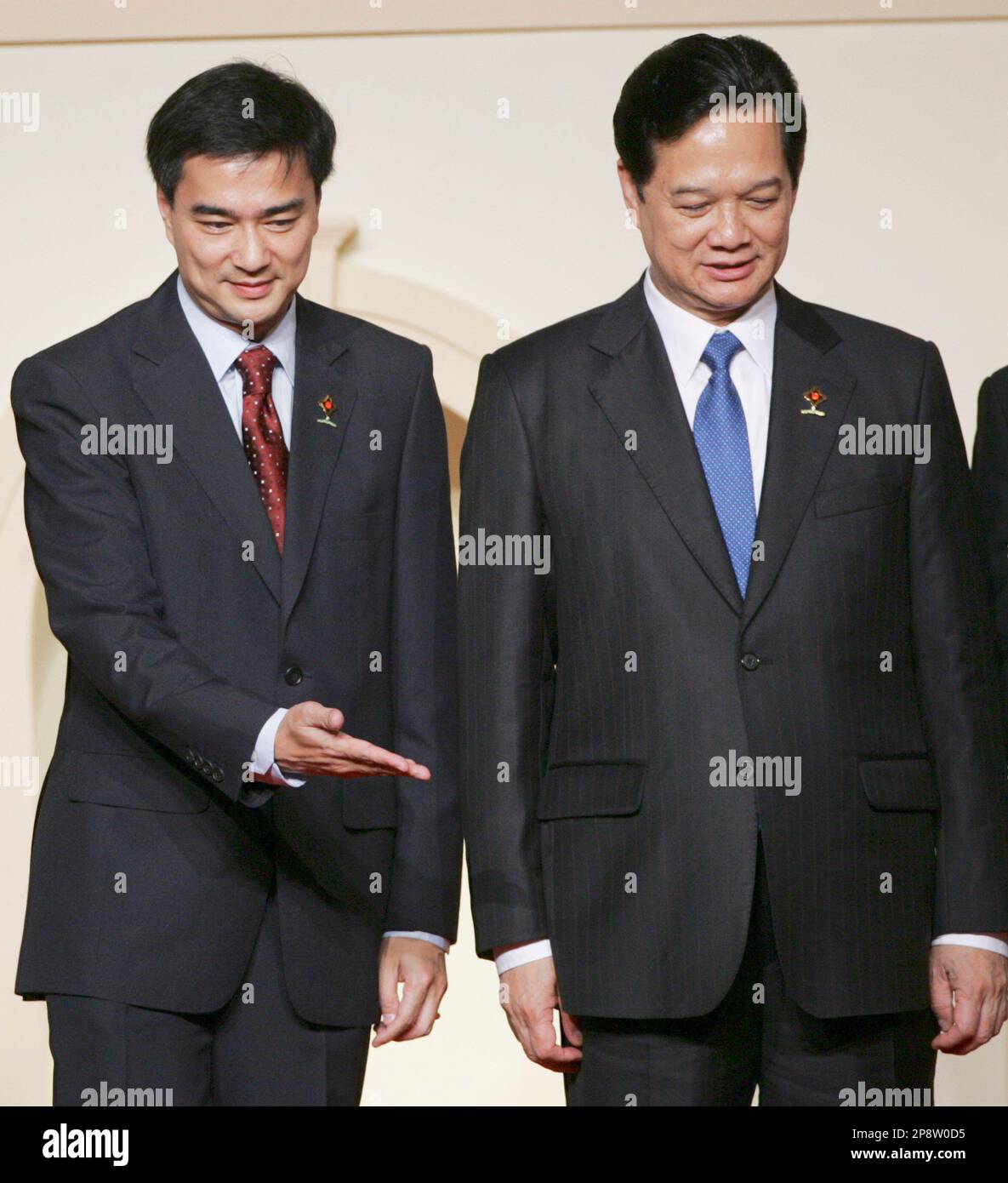Thailand's Prime Minister Abhisit Vejjajiva, left, and Viet Prime Minister Nguyen Tan Dung leave ...