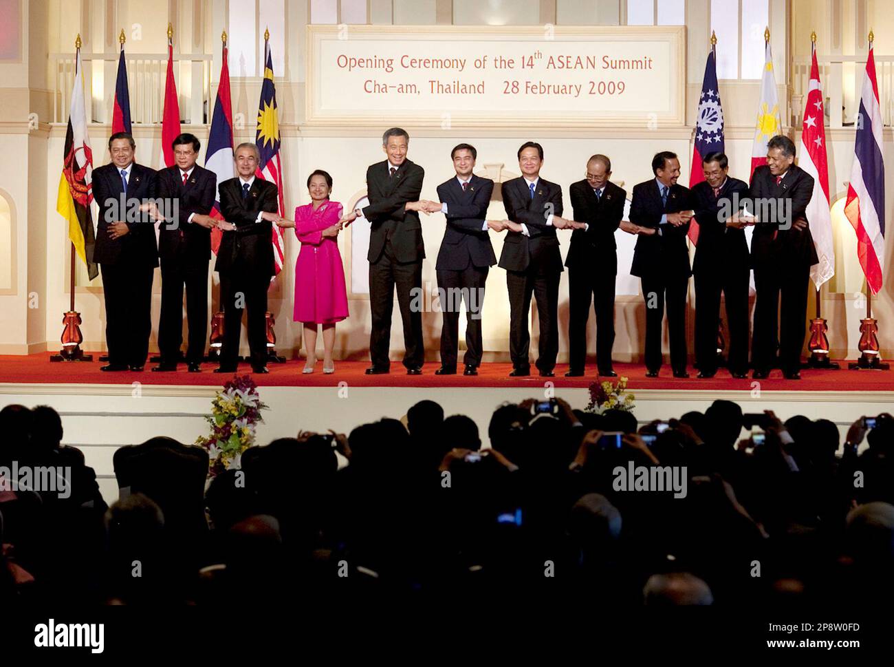 ASEAN leaders join in a traditional handshake during opening ceremonies ...