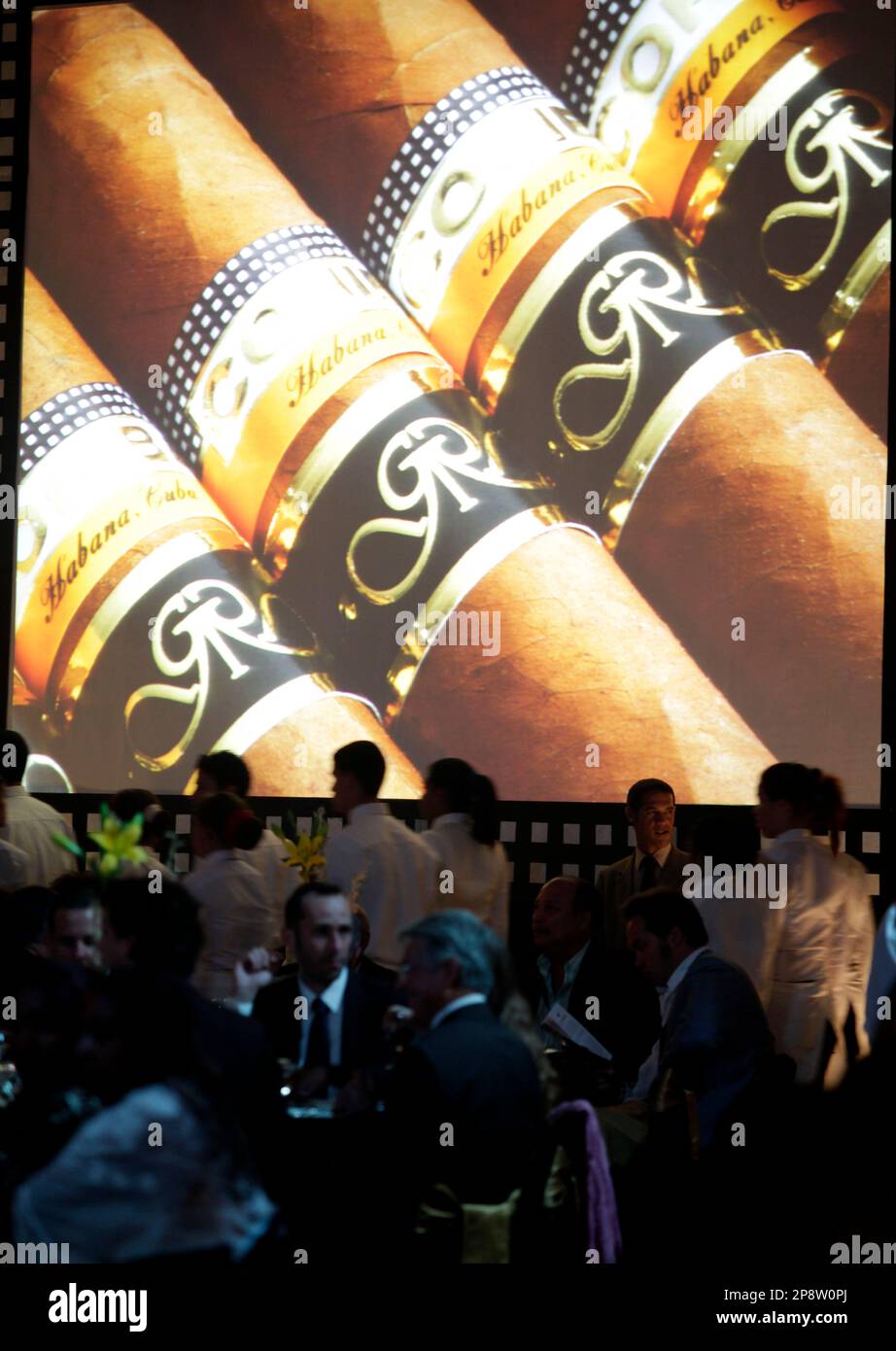Cigar aficionados attend a gala dinner closing the 11th annual Cigar ...
