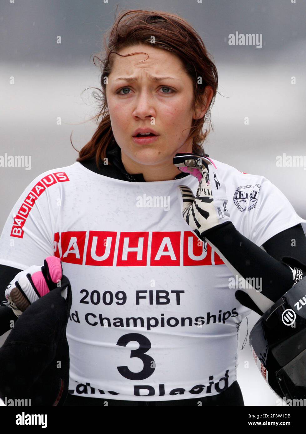Katie Uhlaender, of the United States, walks up the track after ...