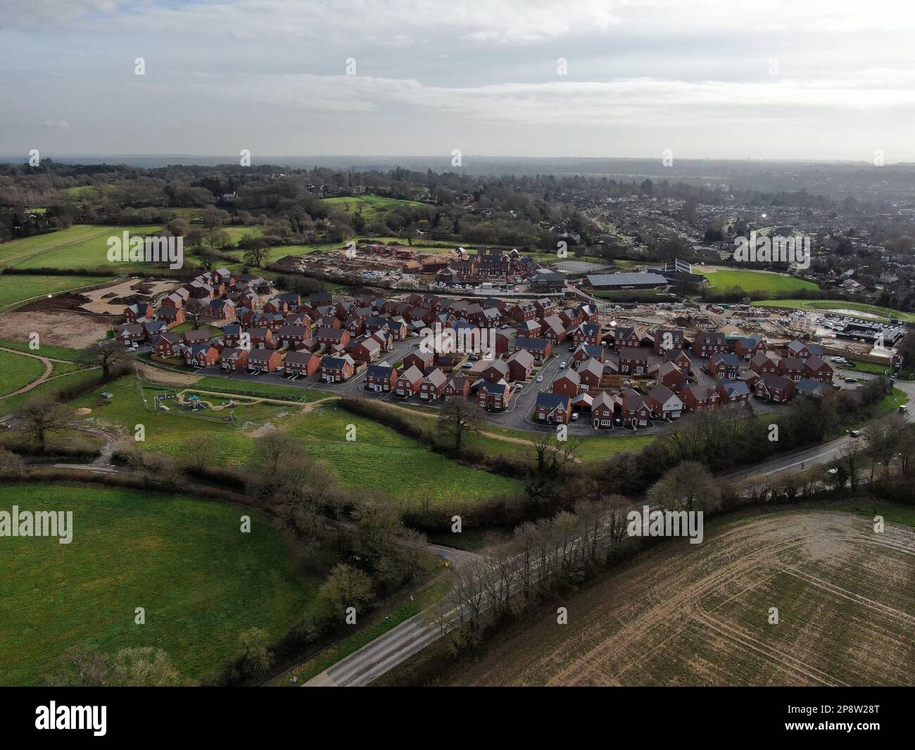 Aerial view of a new housing development being built on green fields at ...