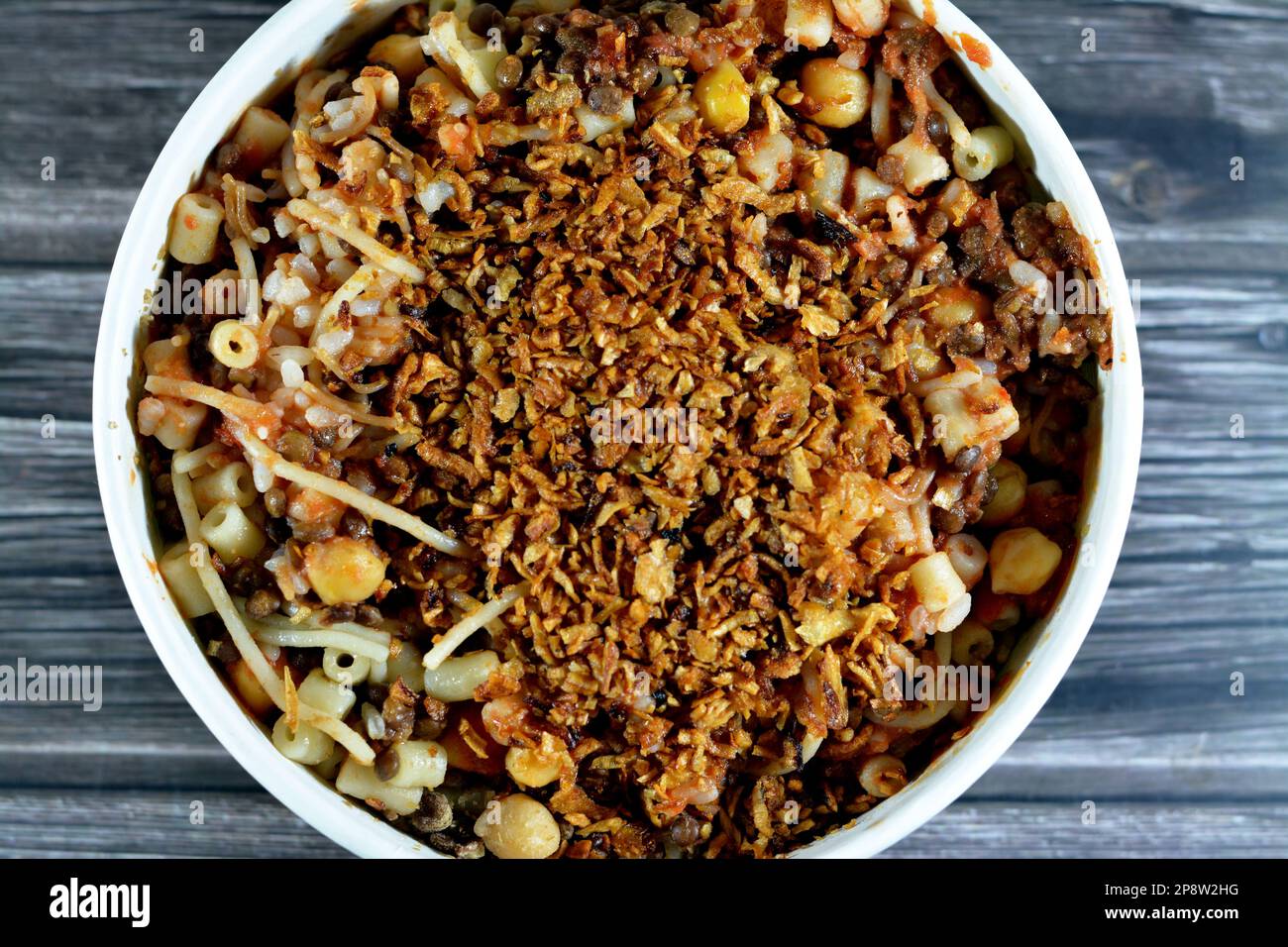 Egyptian cuisine of Koshary, a popular street food made of rice ...