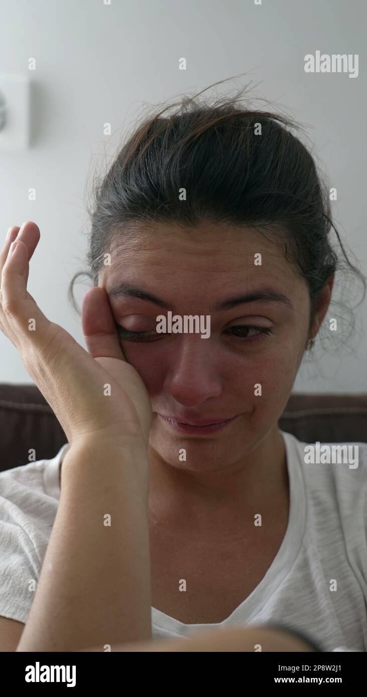 One tearful woman wiping tears. Crying female person going through hard ...