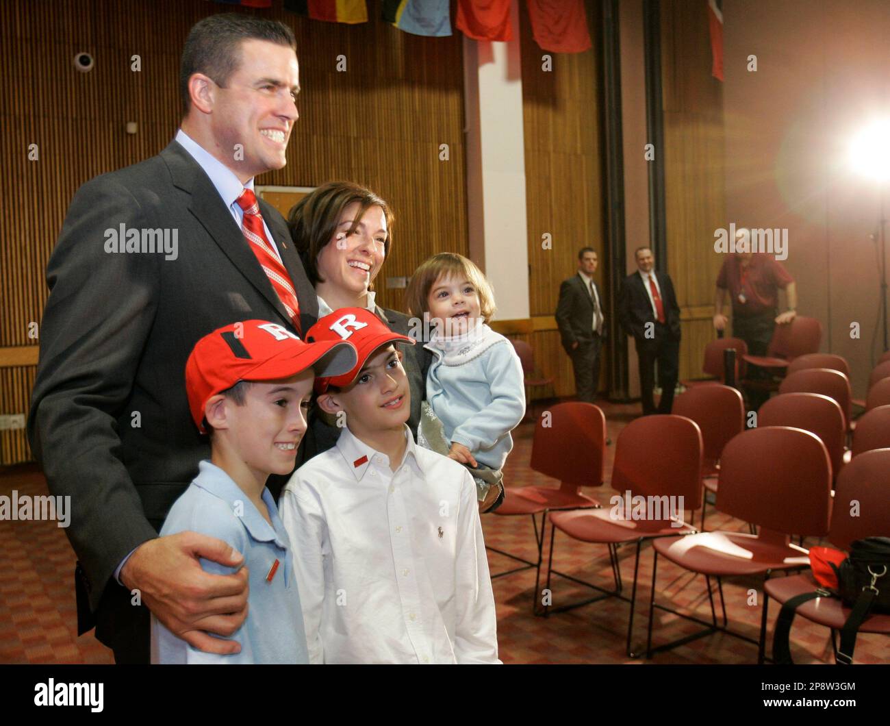 Tim Pernetti poses with his family after a news conference where he was ...