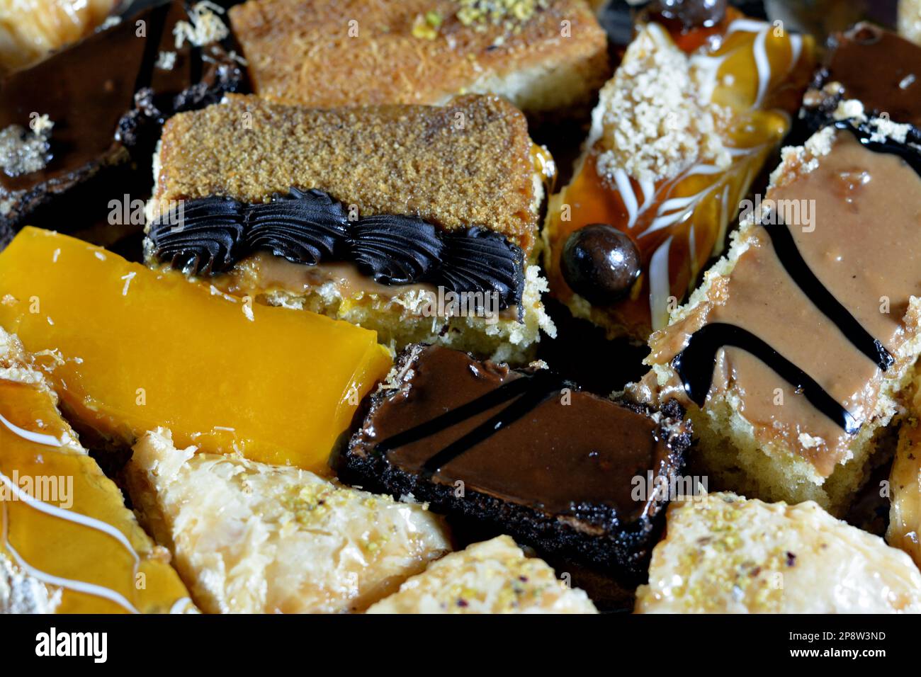 Eastern Ramadan desserts and pastries of Konafa covered with mango ...