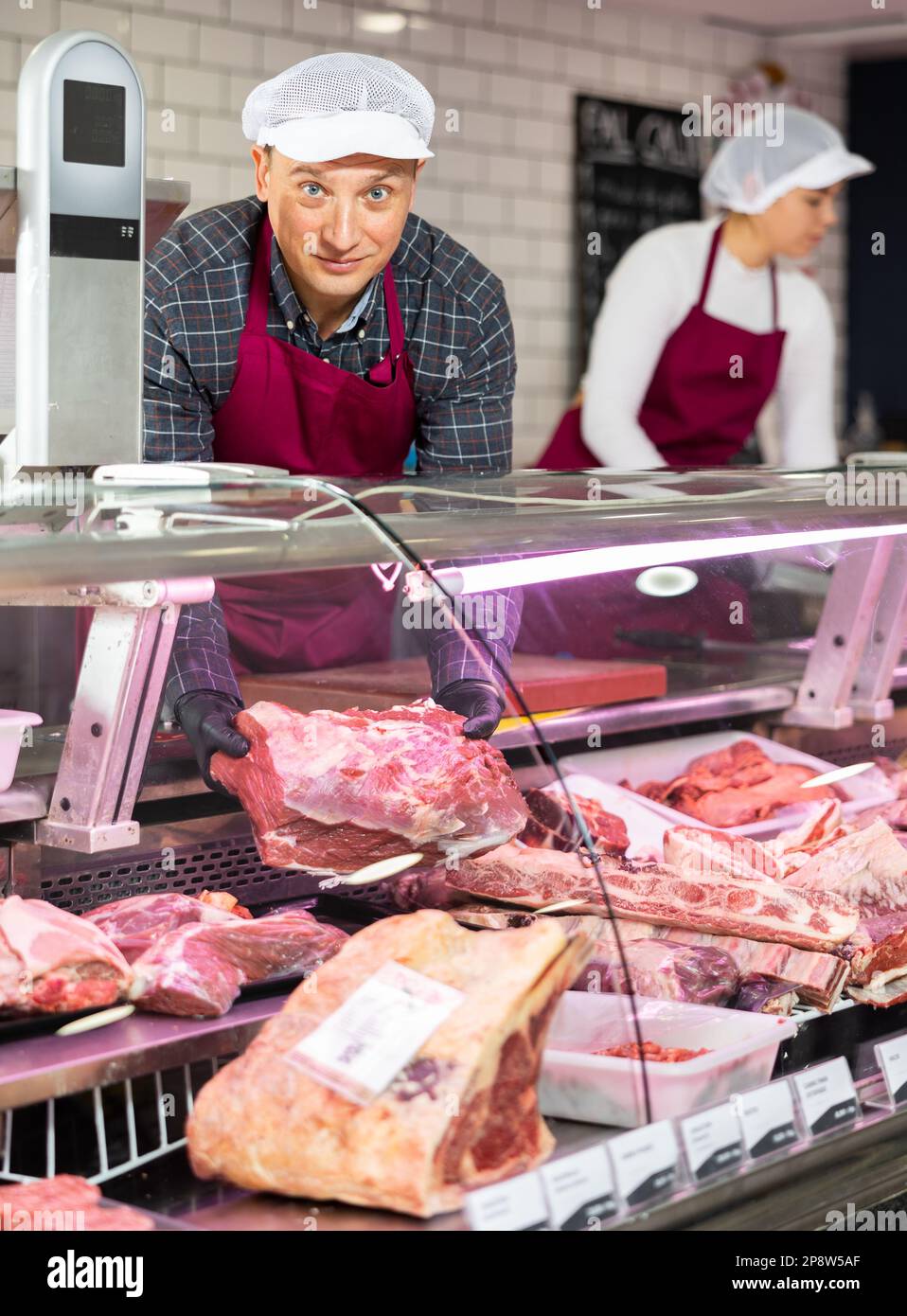 Adult man puts meat hi-res stock photography and images - Alamy