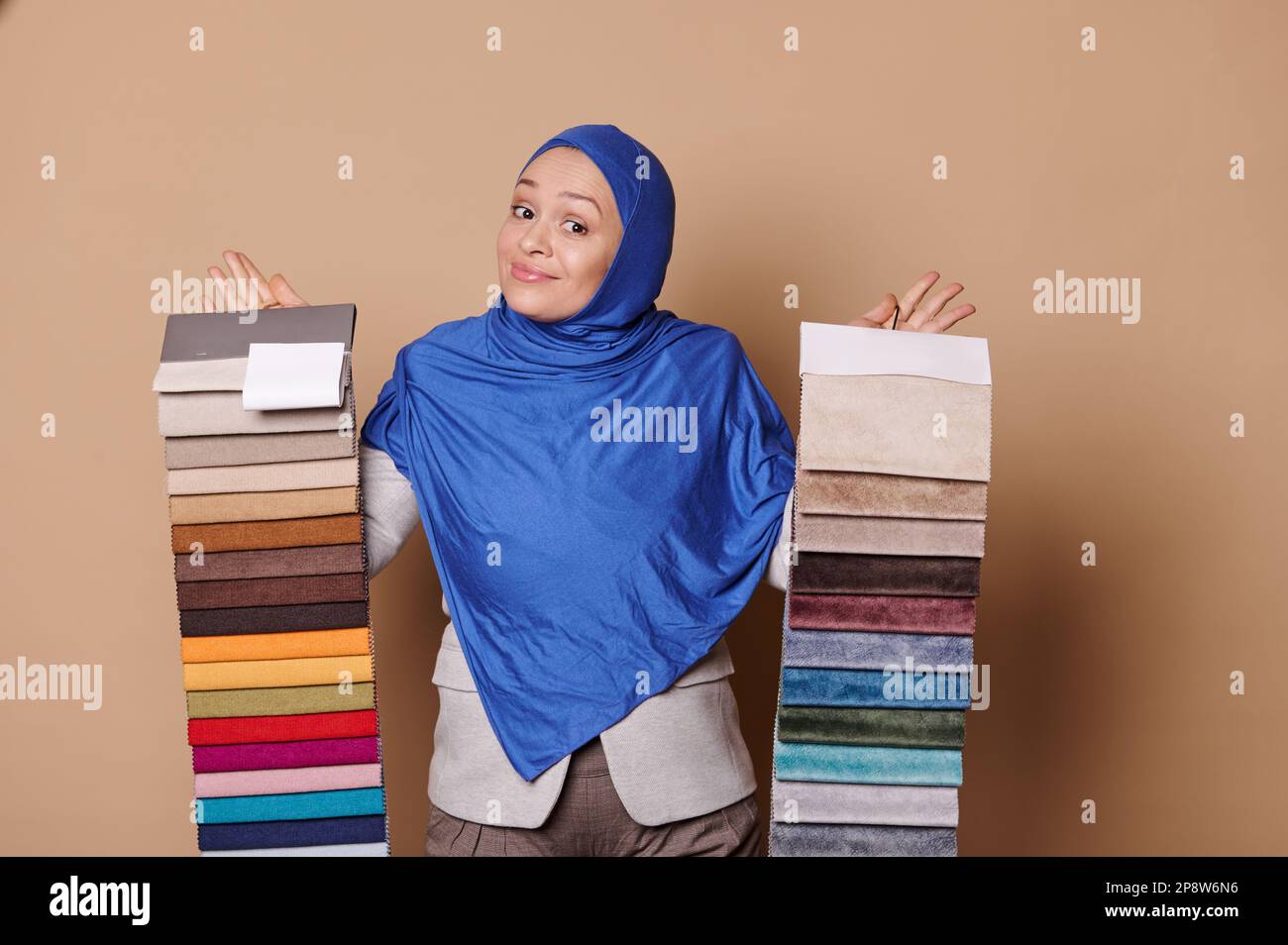 Successful Arab Muslim woman in hijab, home decorator, interior ...