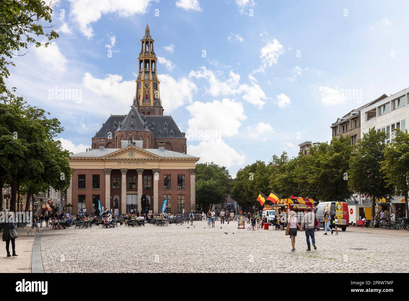 Grain exchange building and church tower on the fish market square in ...