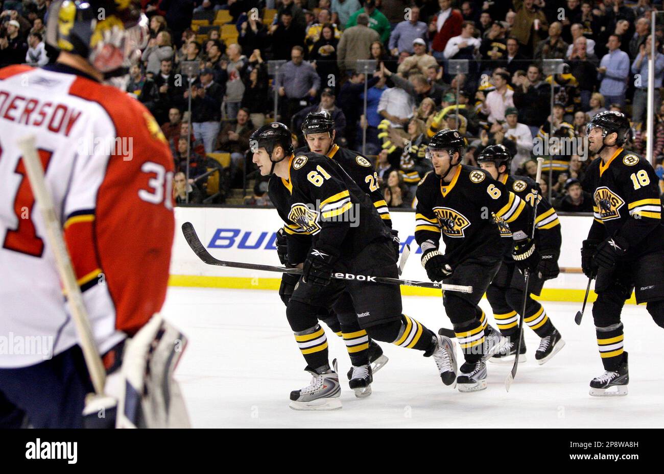 Boston Bruins right wing Byron Bitz (61) leads his team off the ice ...