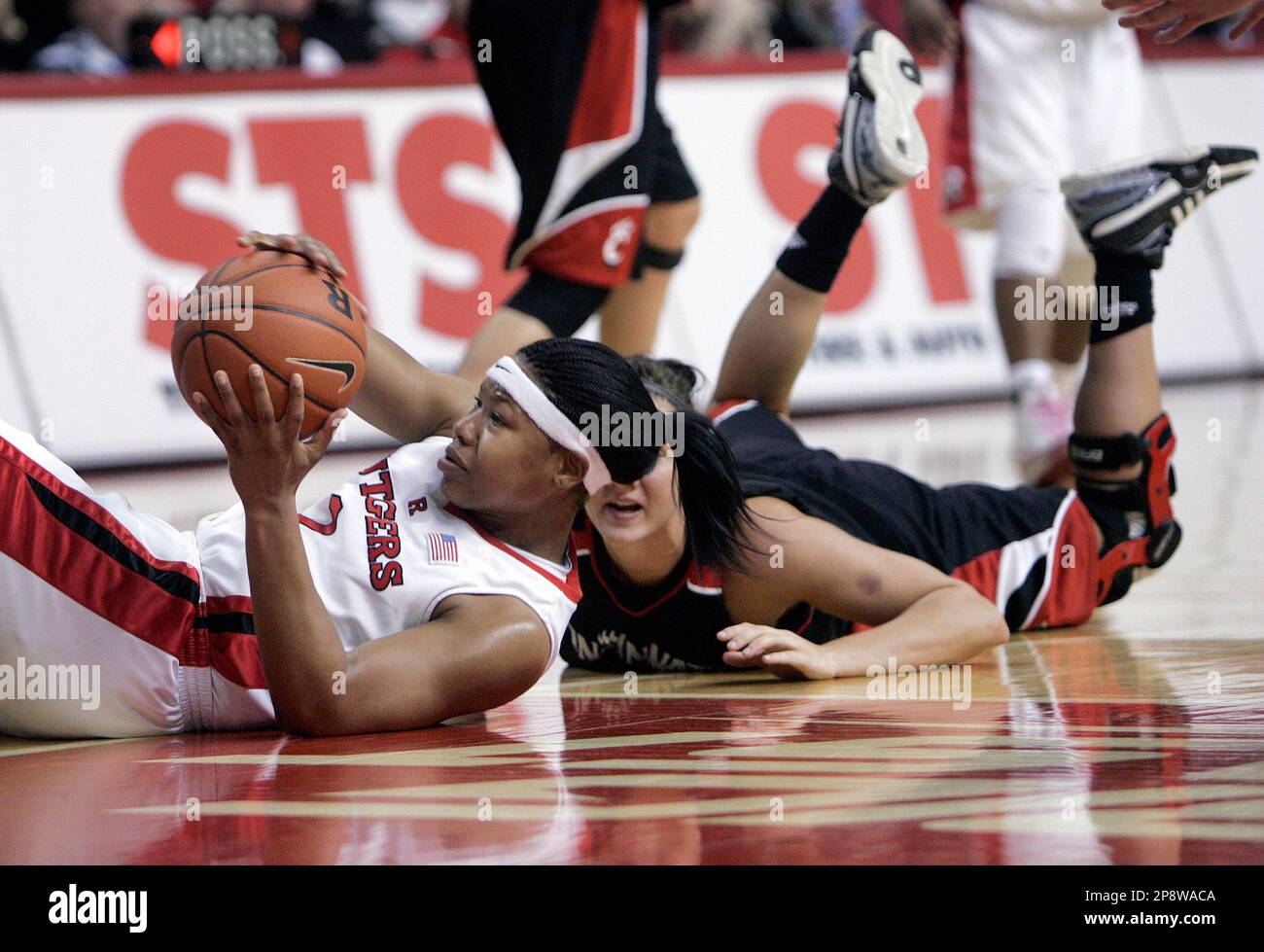 Rutgers' Khadijah Rushdan looks to pass the ball from the floor in ...