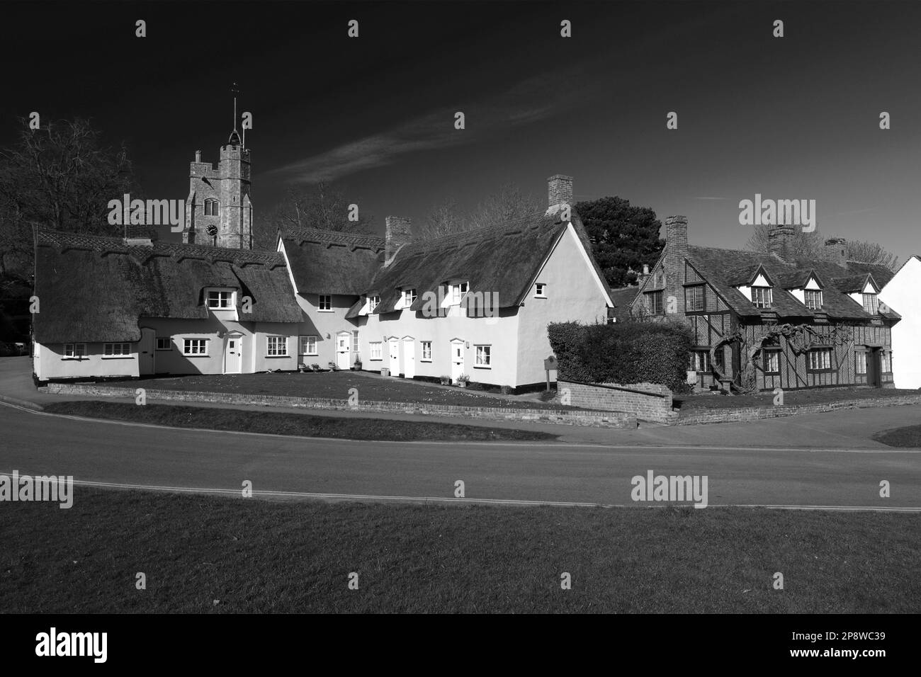 Cottages and the church of St Mary, Cavendish village, Suffolk, England ...