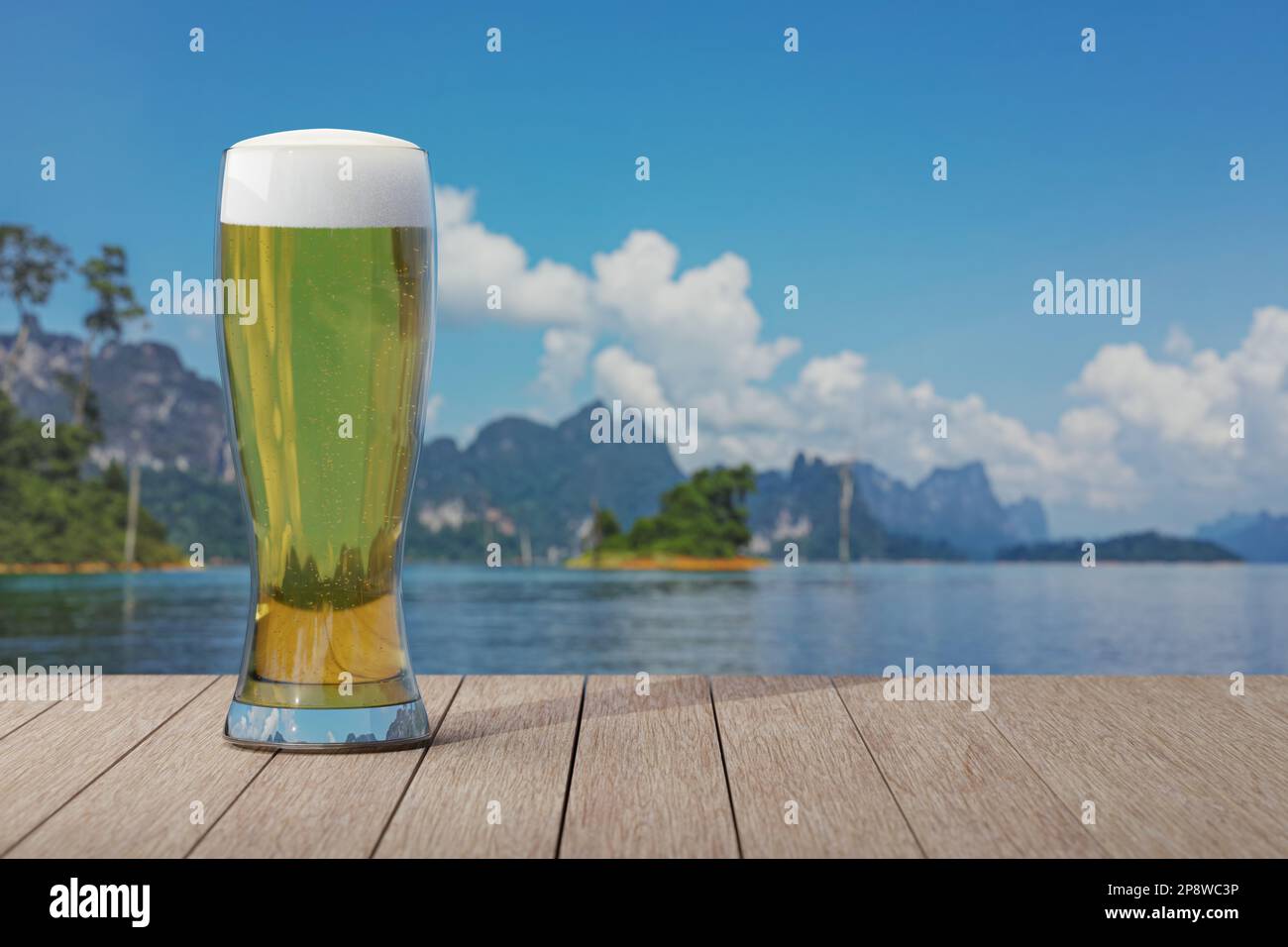 Glass of light beer on table with view of lake with islands with ...