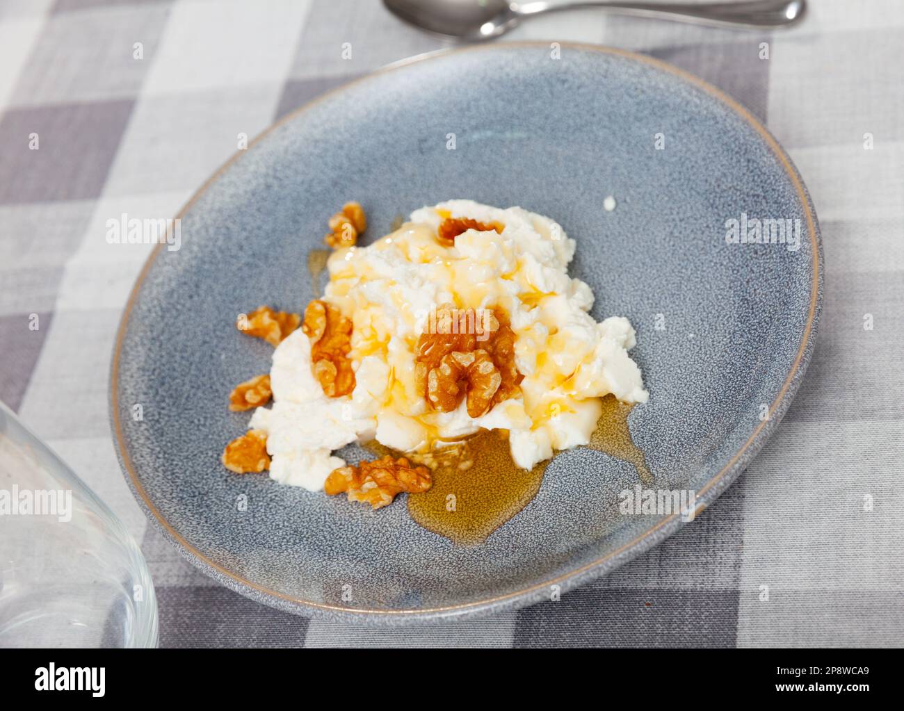 Cottage cheese with walnuts and honey Stock Photo - Alamy