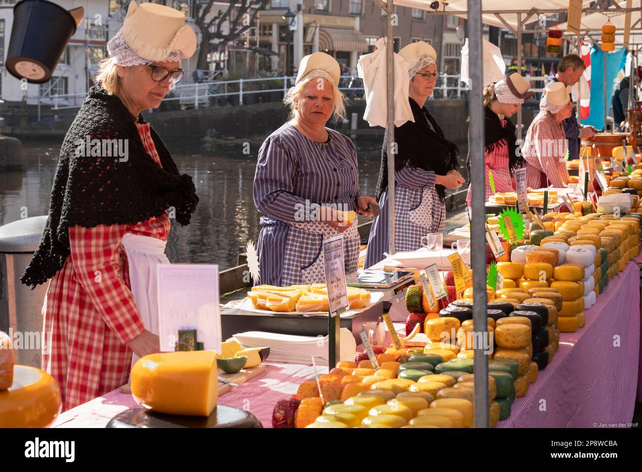 Female cheese sellers with traditional clothing on a market stall at ...