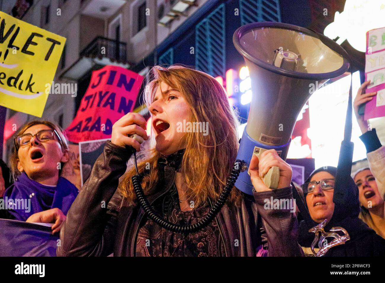 Izmir, Turkey. 08th Mar, 2023. A protester chants slogans through a ...
