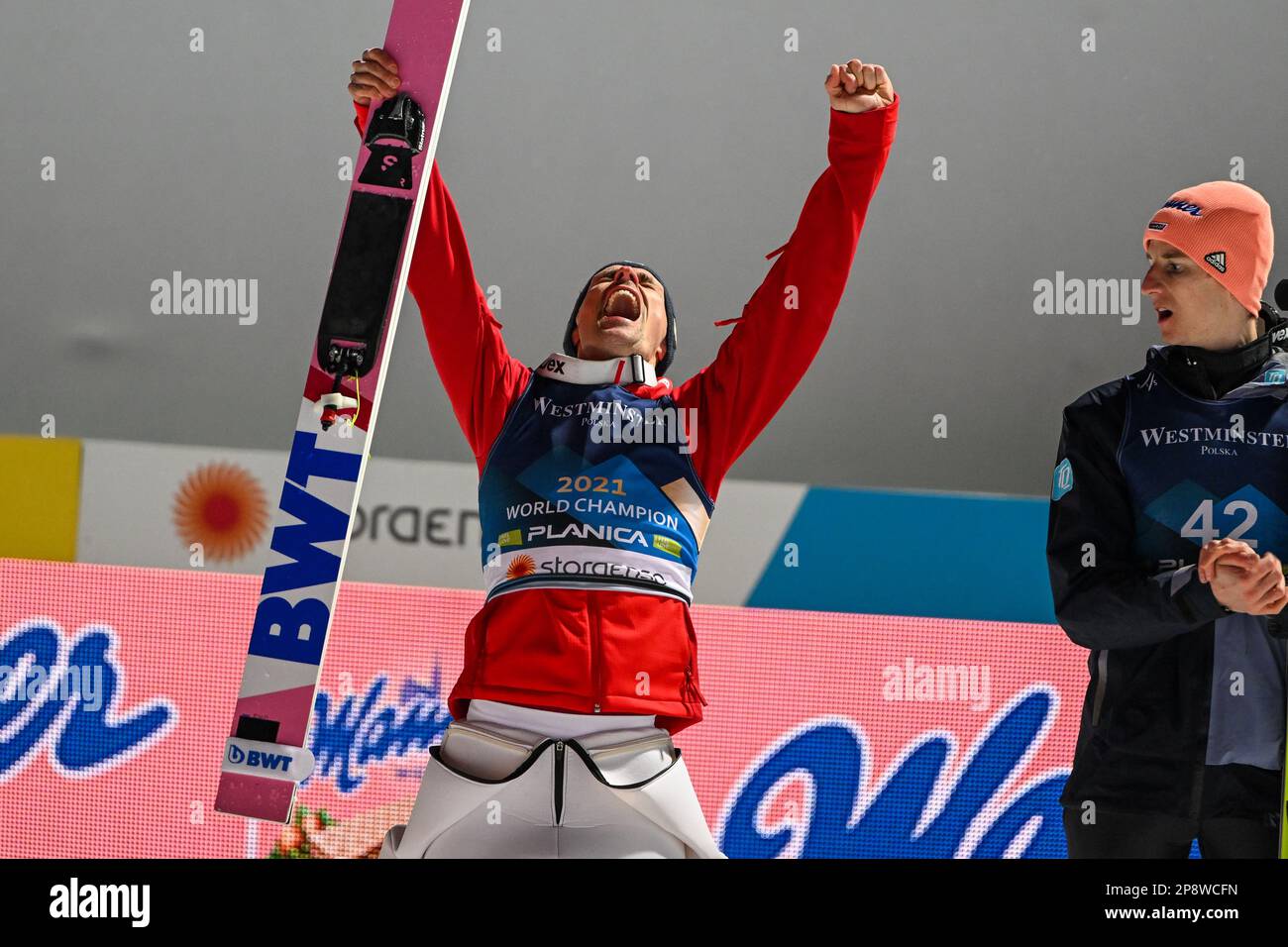 Piotr Zyla of Poland celebrates after winning the Men HS102 ski jumping ...