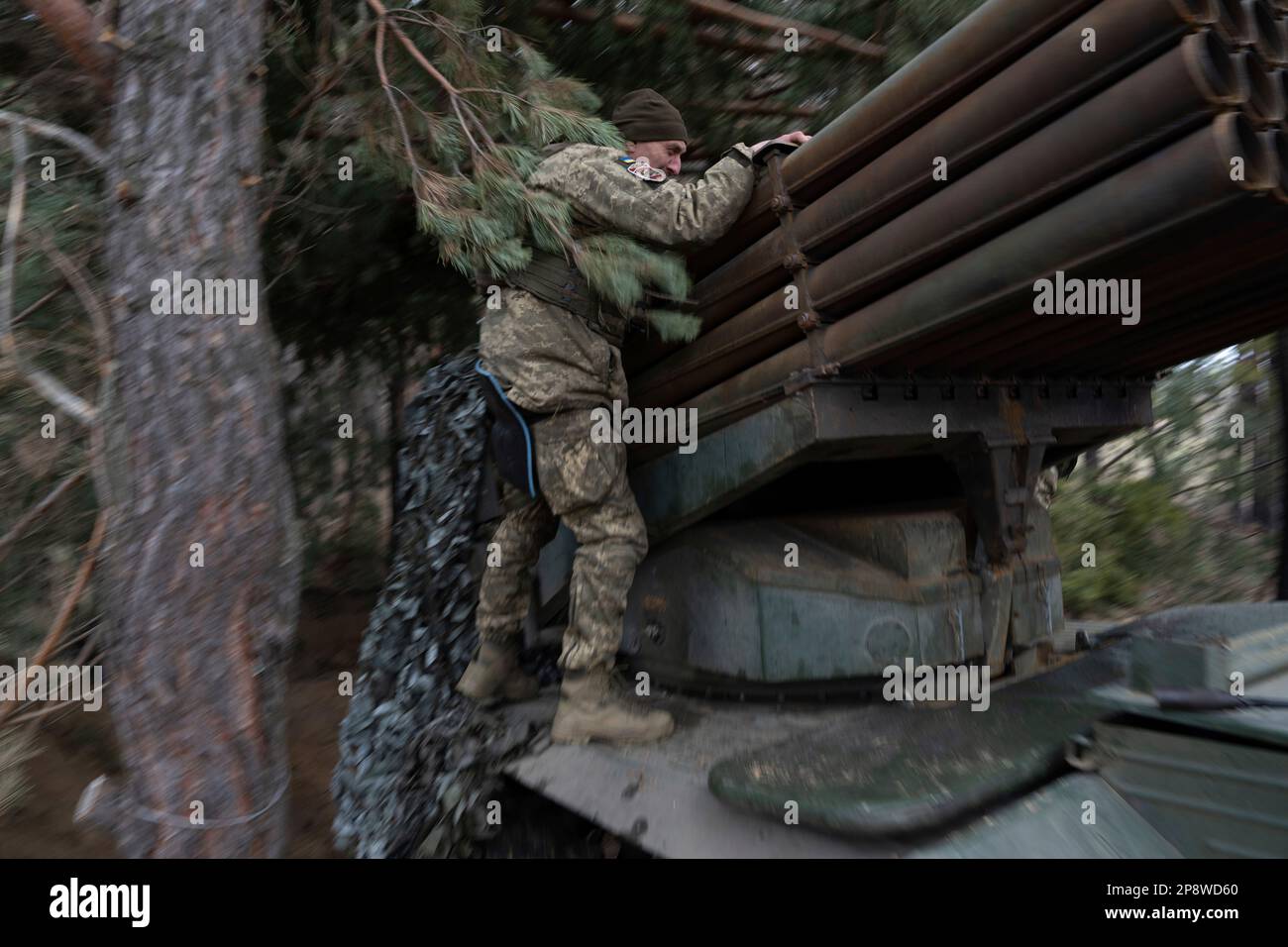 A Ukrainian paratrooper of 95 Air Assault brigade rides atop on MSLR BM ...