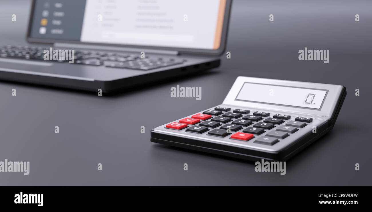 Calculator silver digital, zero screen and opened computer laptop on ...