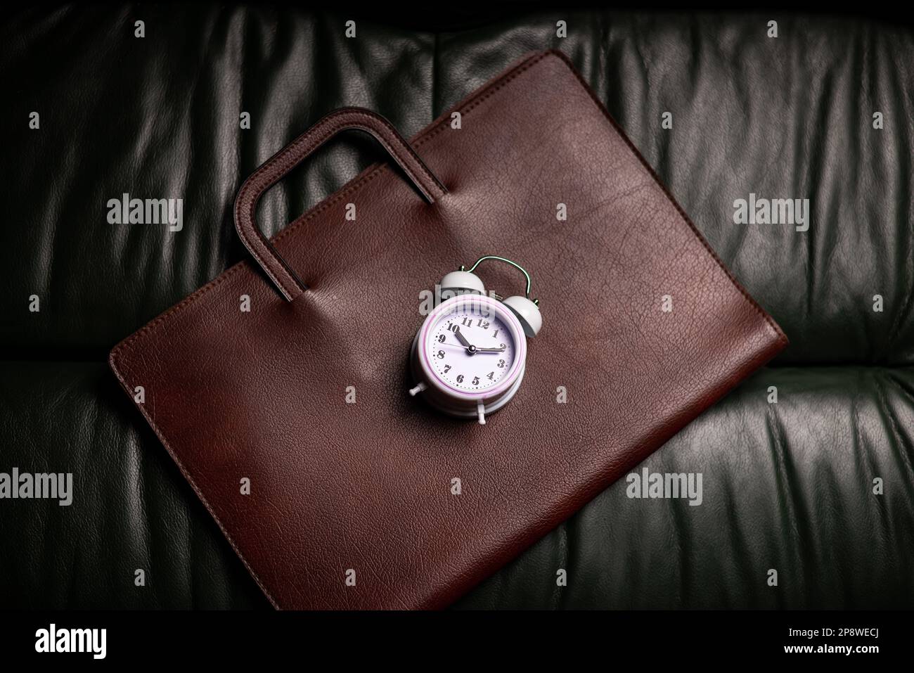 Time management, deadline concept. Alarm clock on folder for papers on ...