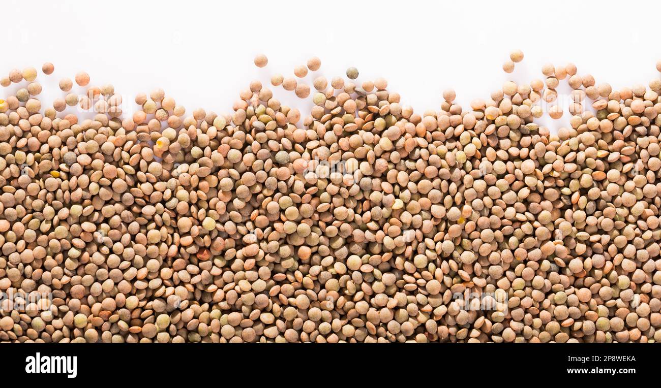 Lentil grains on white background Stock Photo - Alamy