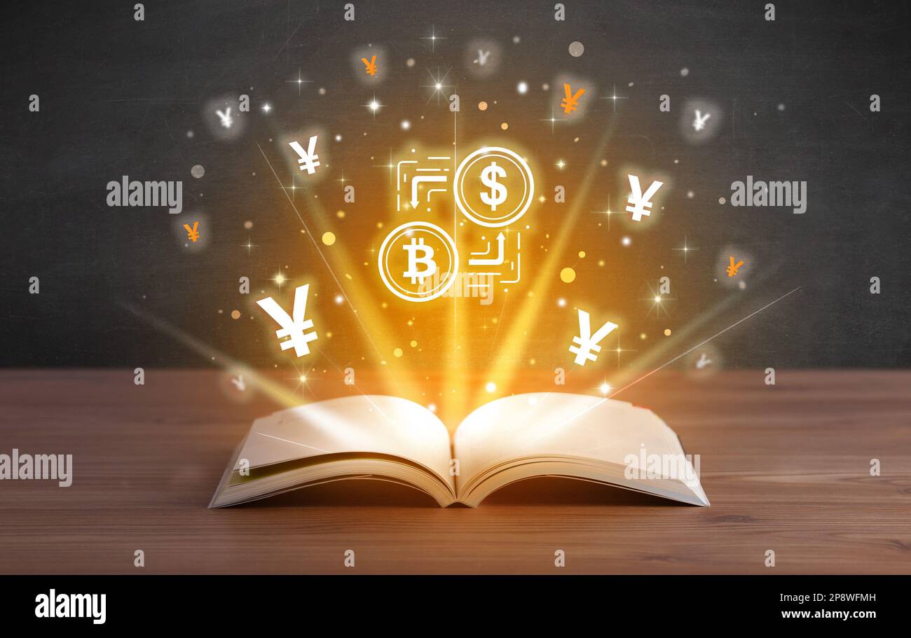 Open book with currency icons above Stock Photo - Alamy