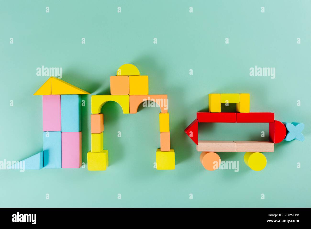 Colorful children's wooden construction set. Castle figures and car ...