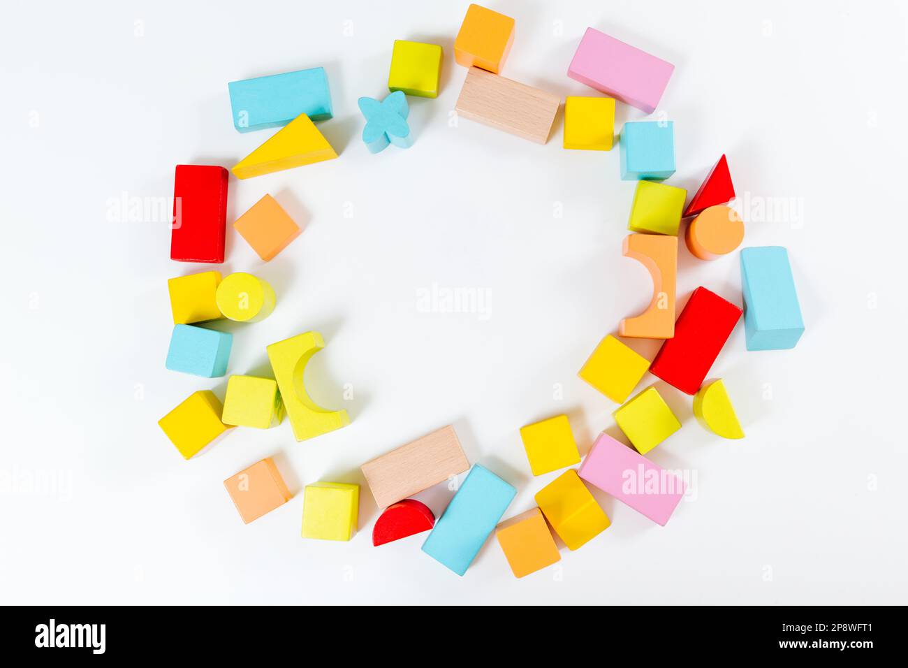 Colorful children's wooden construction set. White background. Flat lay ...