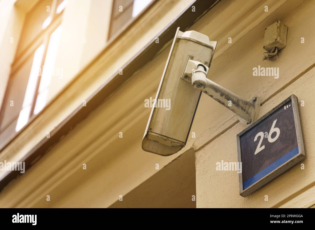Surveillance camera installed on the wall of an old building. Video ...