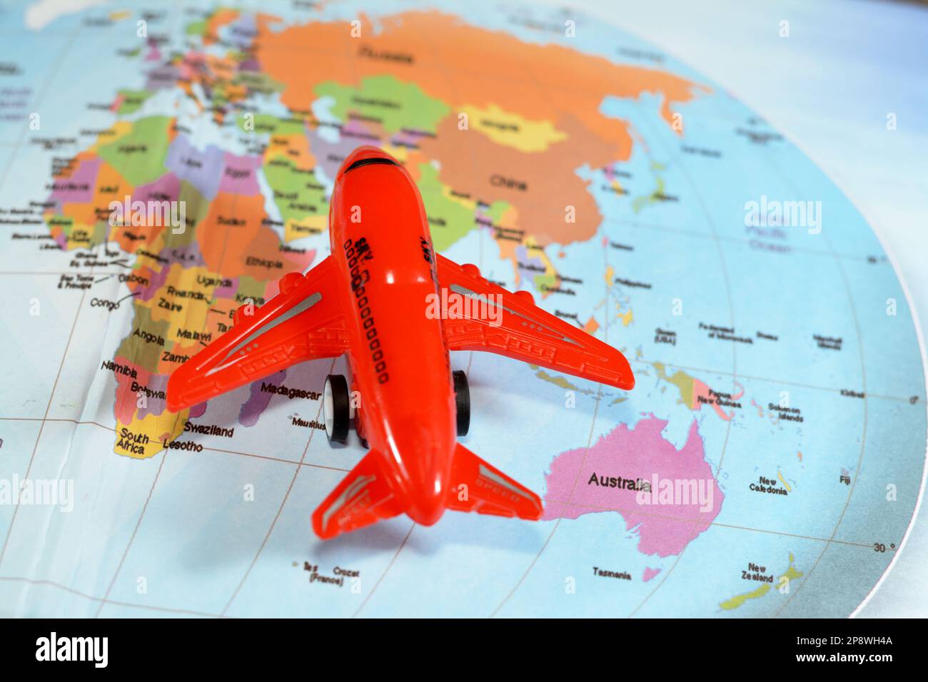 Colorful world map with airplane on it with the continents Africa ...