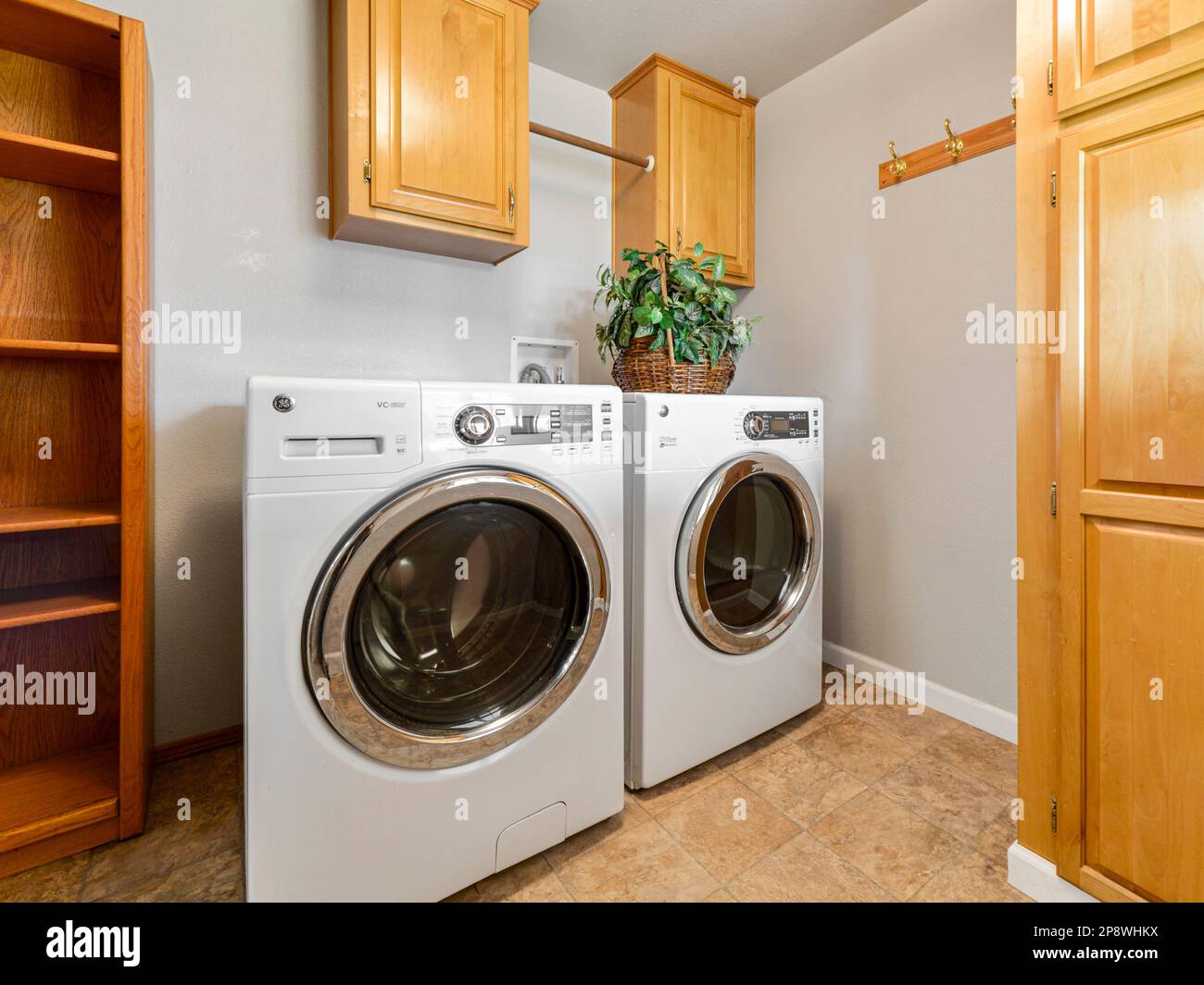 Modern residential laundry room interior Stock Photo - Alamy