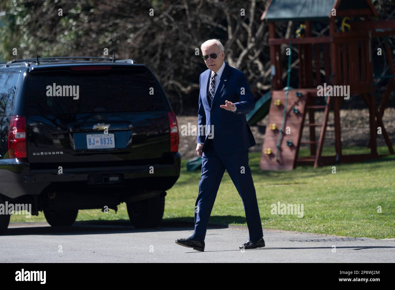 United States President Joe Biden waves as he departs the White House ...