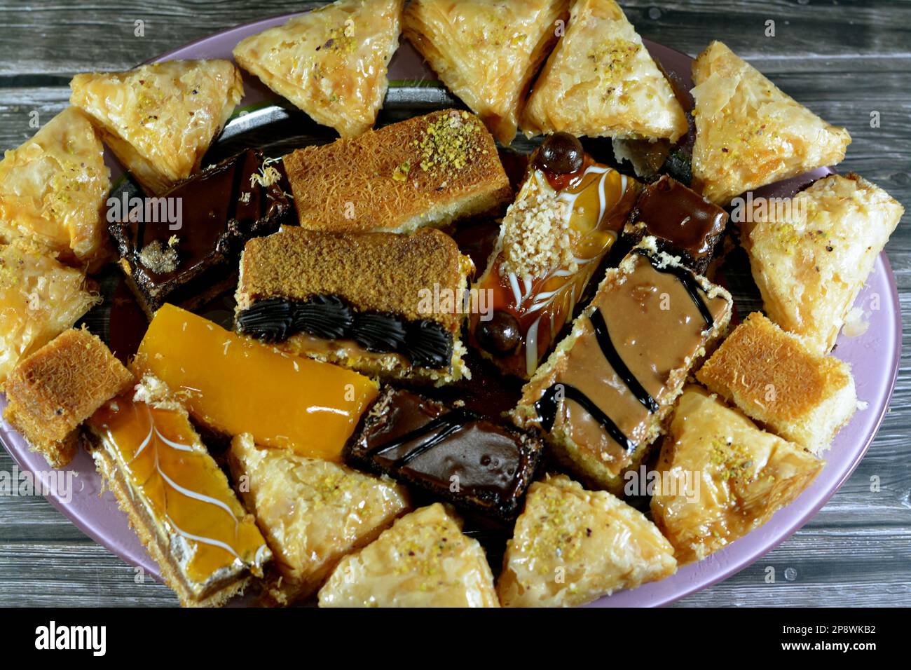Eastern Ramadan desserts and pastries of Konafa covered with mango ...