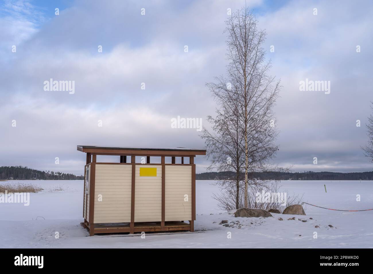 Wooden changing room cabin at the Finnish beach in winter. Hollola ...