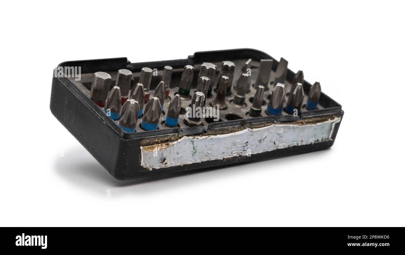 Old used set of screwdriver bits with parts missing, isolated on white ...